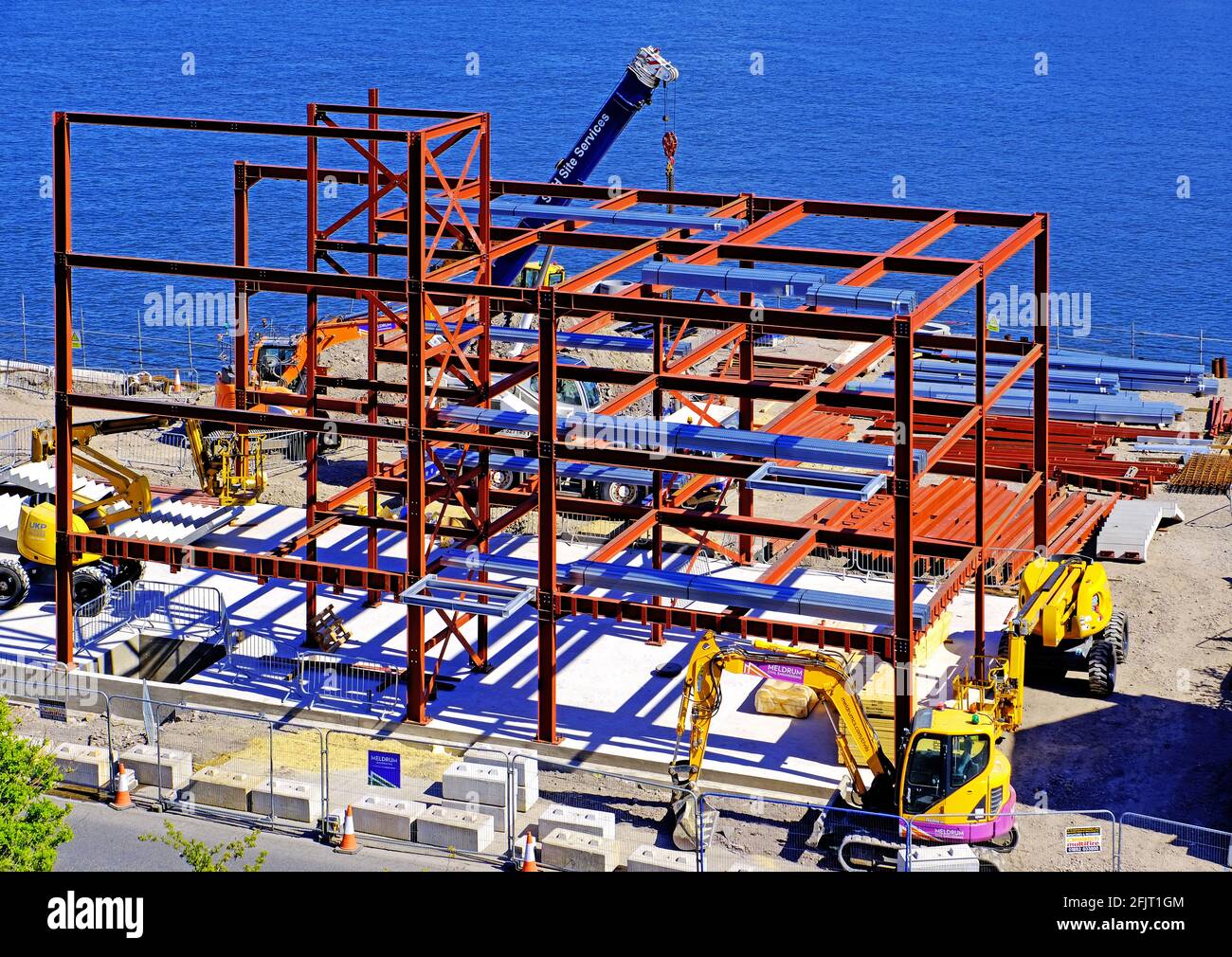 Steel framed 3 storey building being constructed by the riverside Stock ...