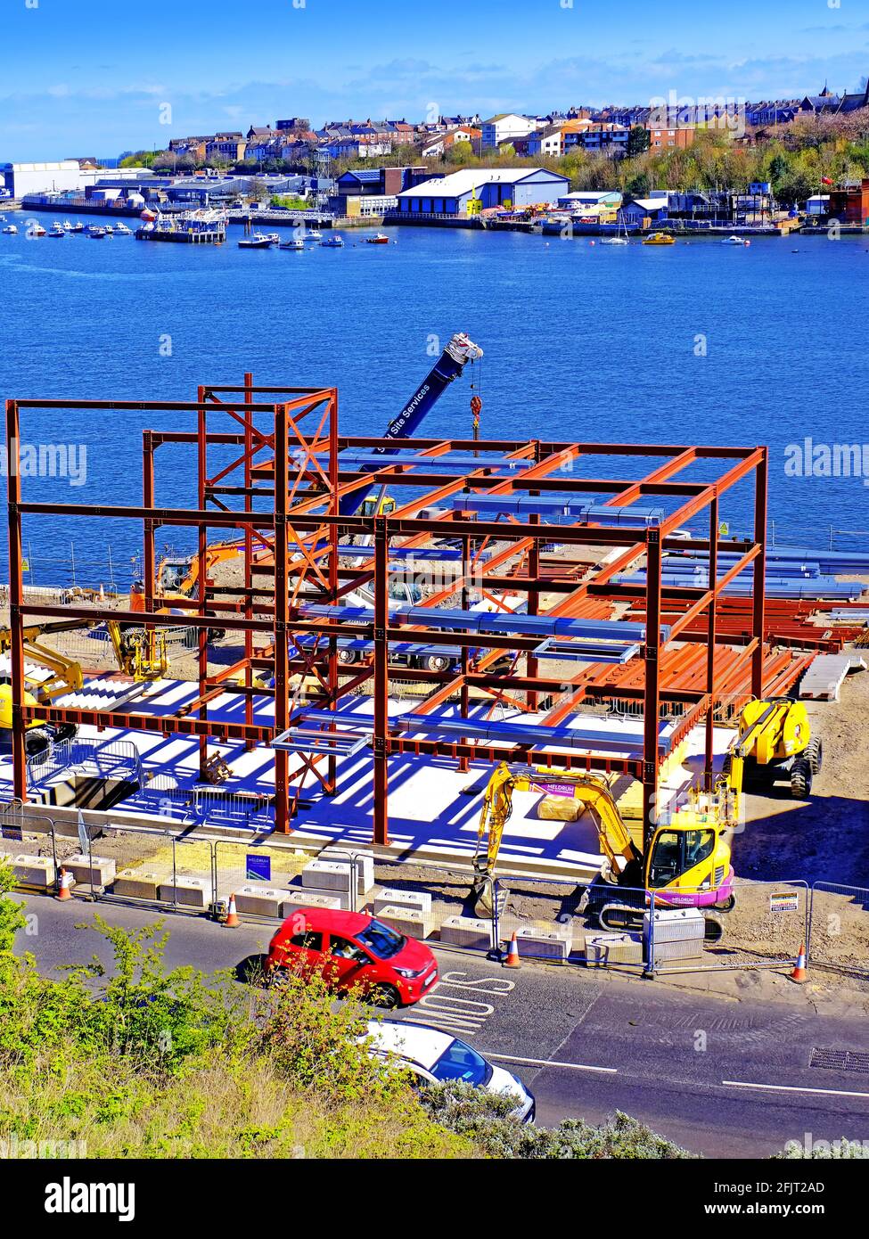 Steel framed 3 storey building being constructed by the riverside Stock ...