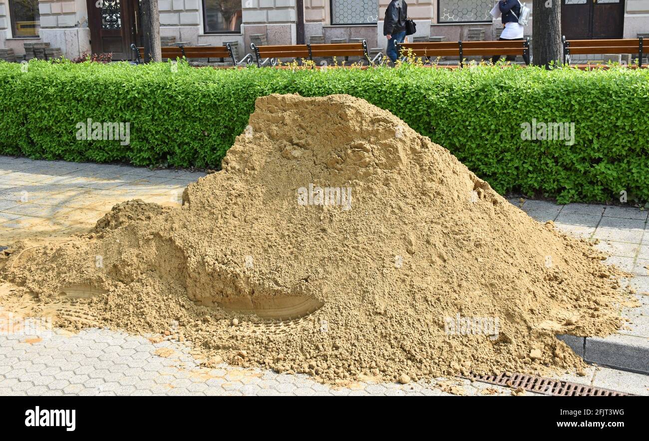 Sand heap on the city street Stock Photo - Alamy