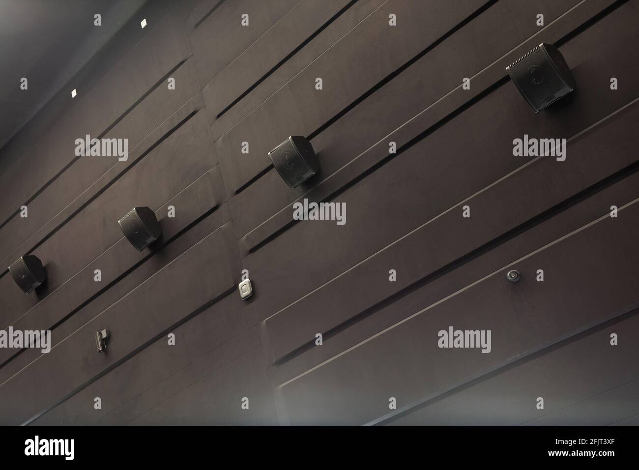 Surround channels acoustics speakers on the side wall of cinema hall ...
