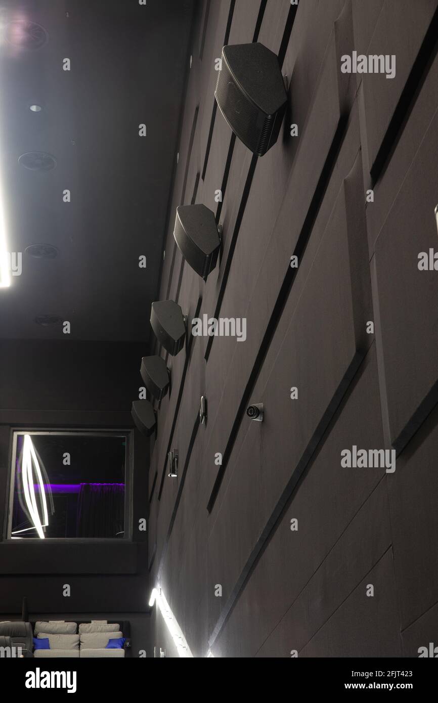 Surround channels acoustics speakers on the side wall of cinema hall ...
