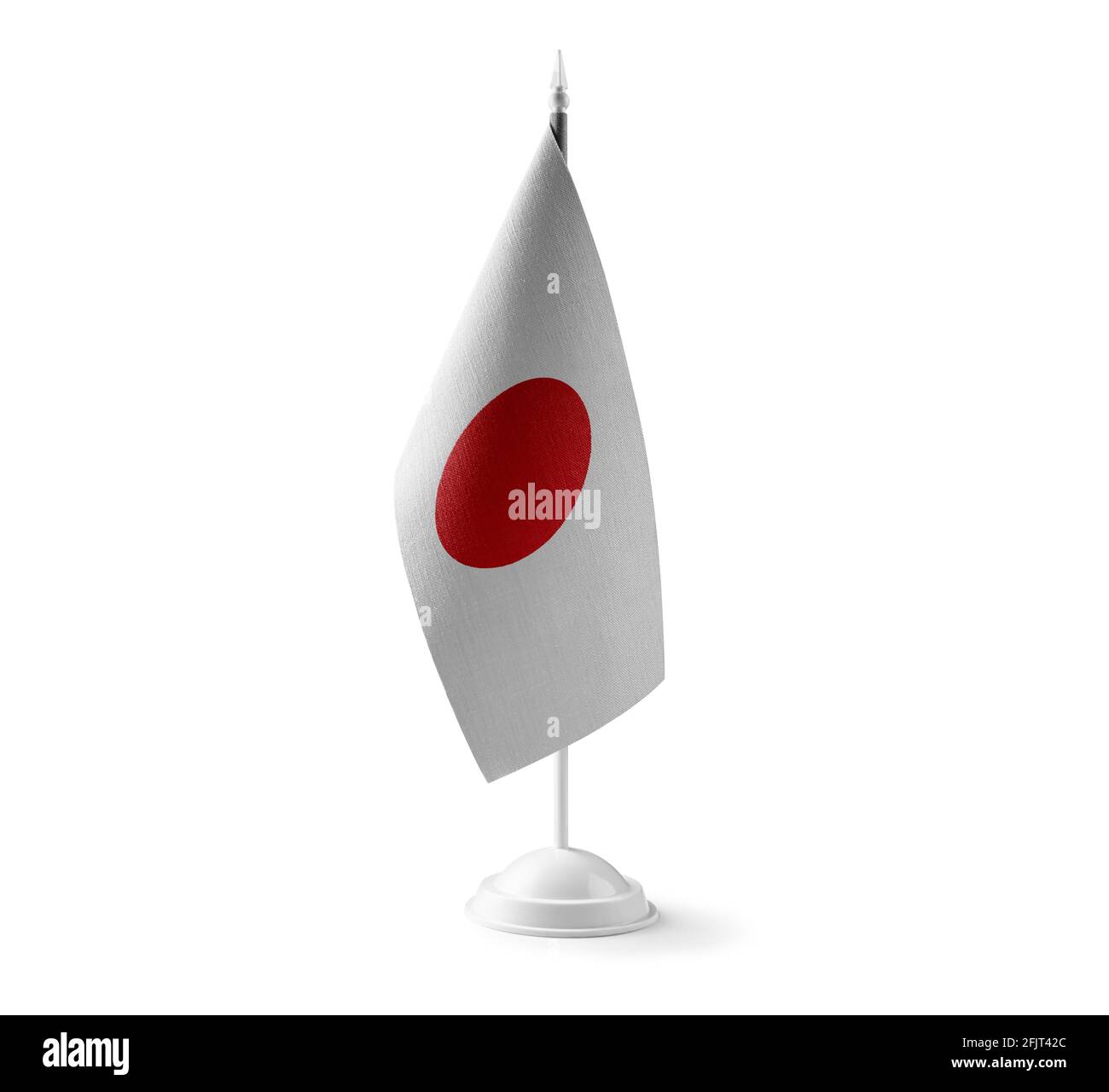 Small national flag of the Japan on a white background Stock Photo - Alamy