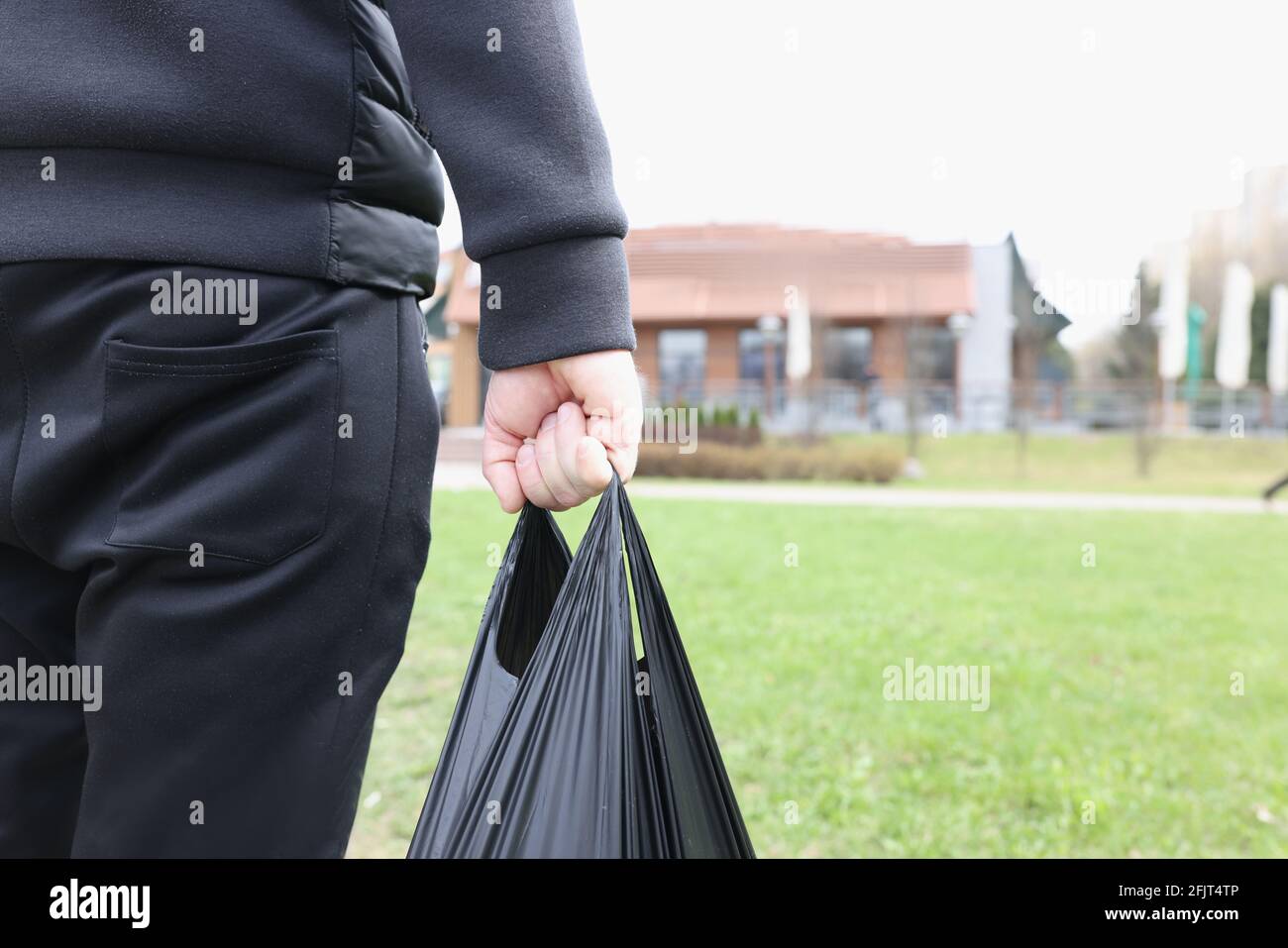 Man carry plastic bag hi-res stock photography and images - Alamy