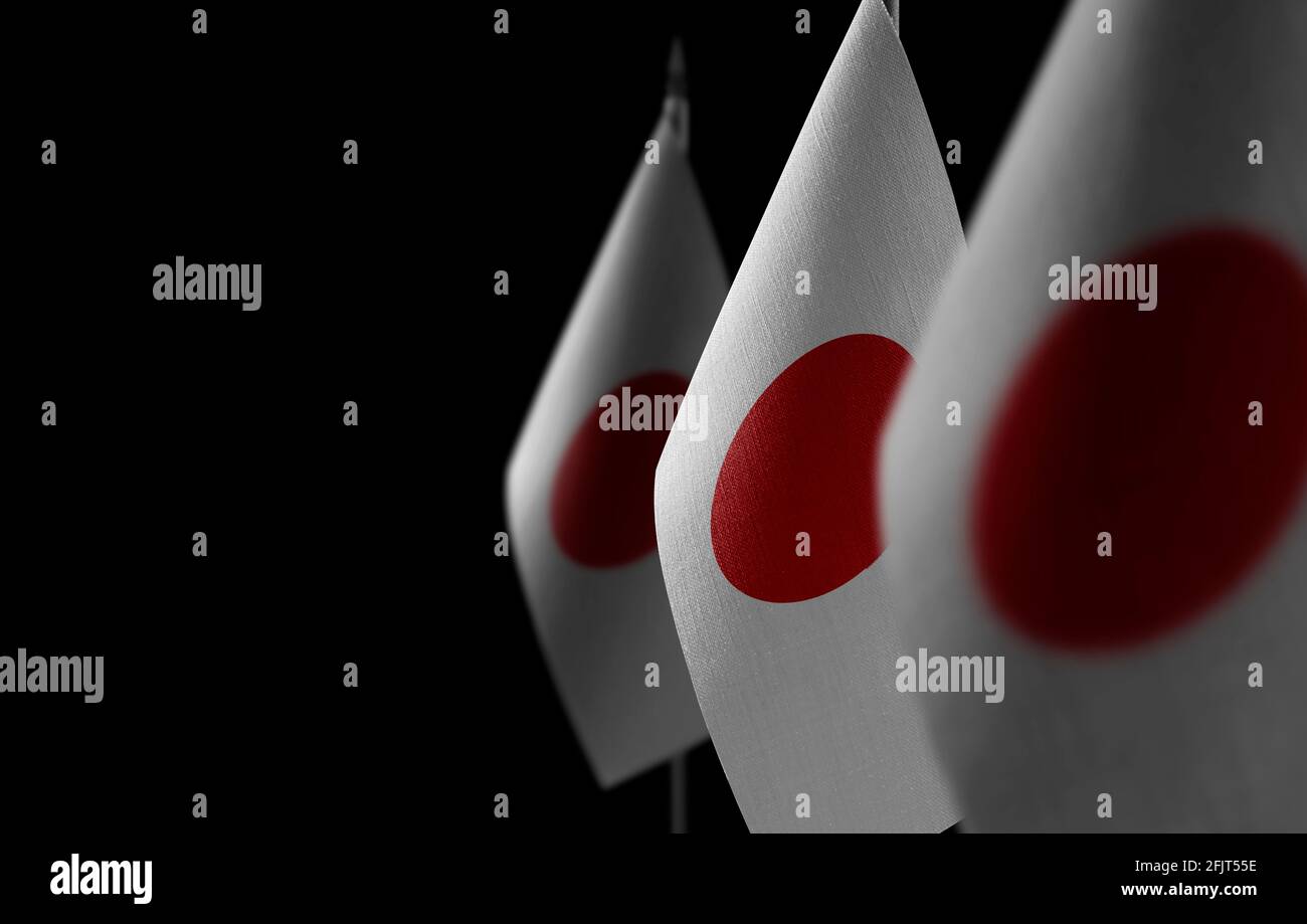 Small national flags of the Japan on a black background Stock Photo - Alamy