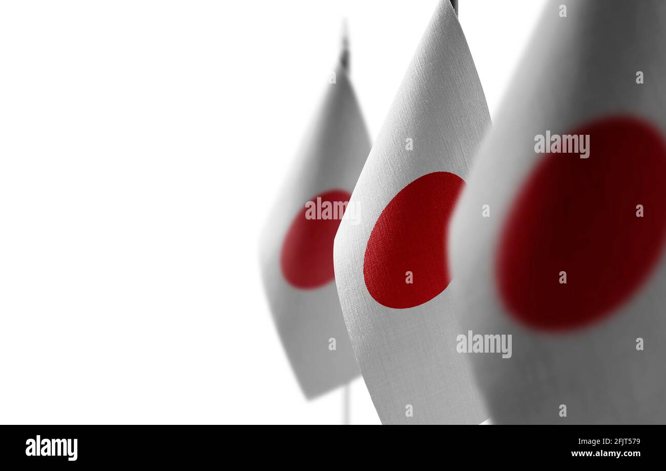 Small national flags of the Japan on a white background Stock Photo - Alamy
