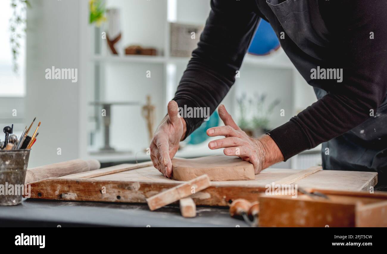 Man modeling with clay hi-res stock photography and images - Alamy