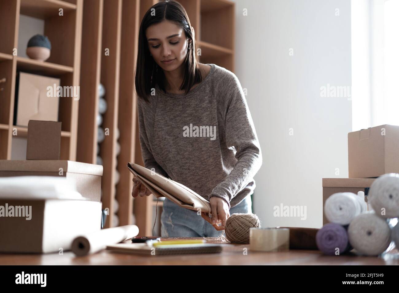 delivery, mail service, shipment concept - Indian mixed-race woman ...
