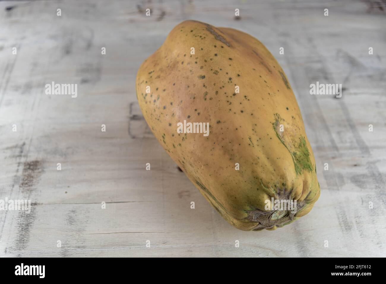 Formosa variety papaya fruit on wooden background. Papaya Formosa ...