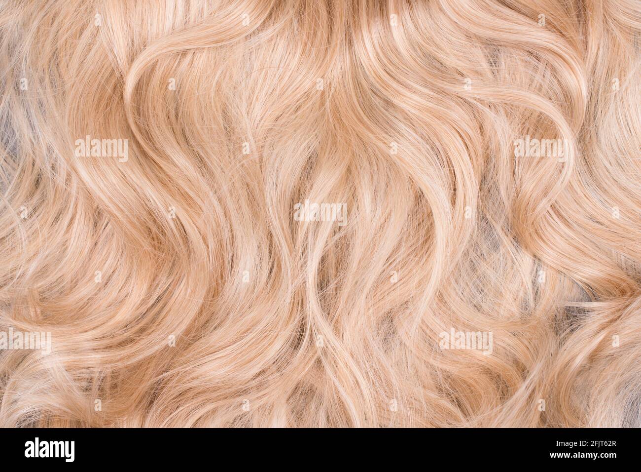 Blonde hair texture. Wavy long curly blond hair close up as background ...