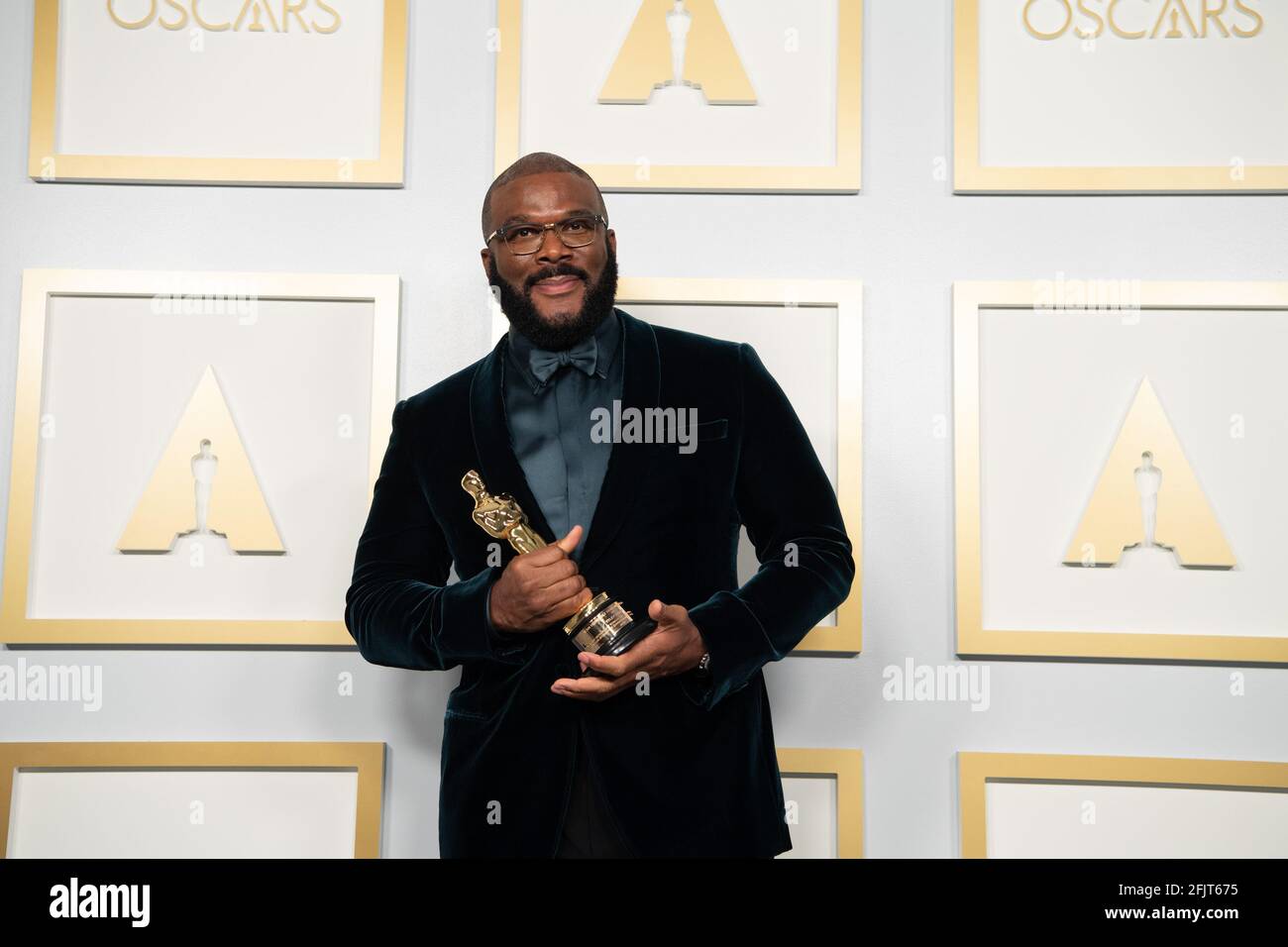 Tyler Perry poses backstage with the Gene Hersholt Humanitarian Award ...