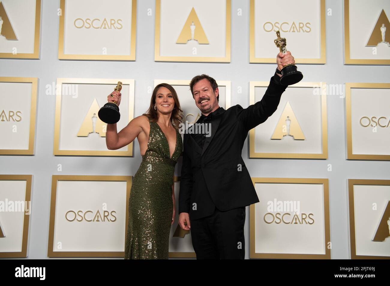 Pippa Erlich and James Reed and pose backstage with the Oscar® for ...