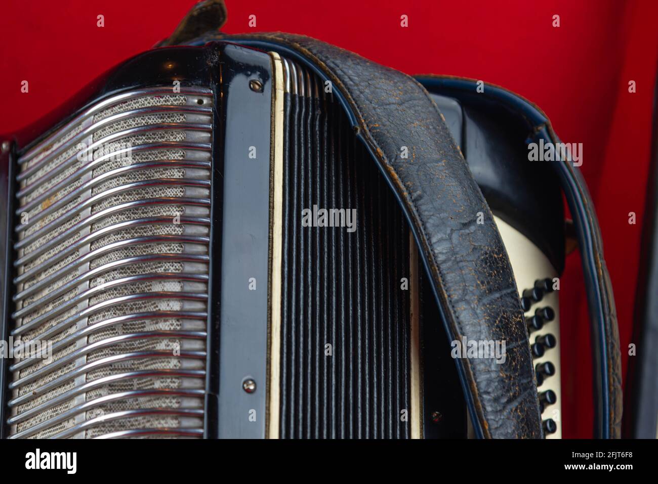 Old musical accordion isolated on dark background. Accordion in close ...