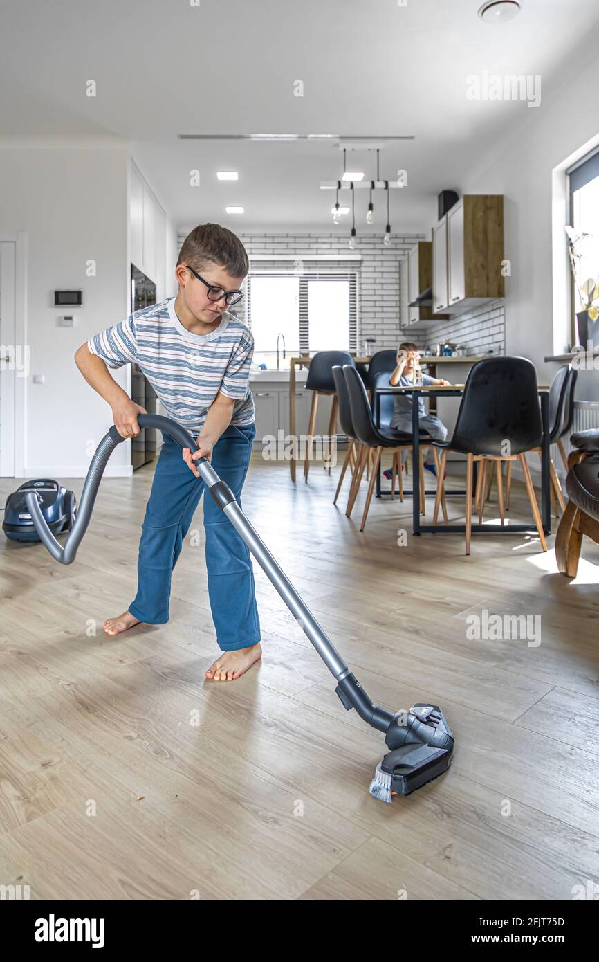 Boy cleans room hi-res stock photography and images - Alamy