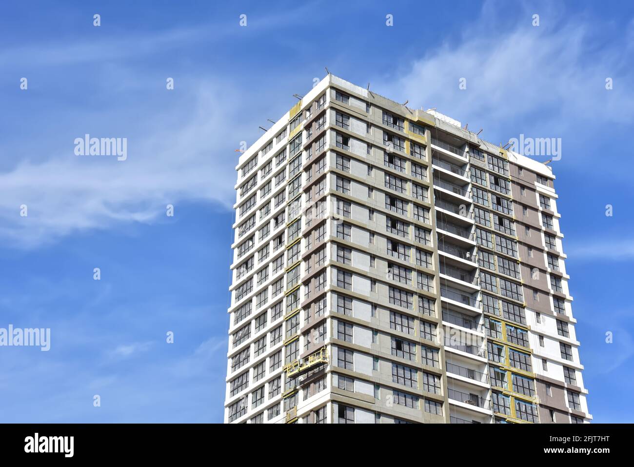 View of the facade of a new multi-storey building under construction ...