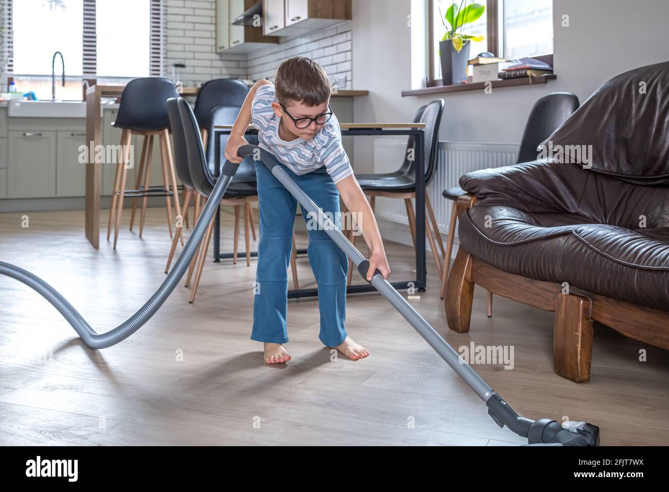 Boy cleans room hi-res stock photography and images - Alamy