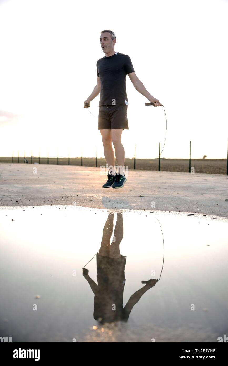 Man jumping in puddle hi-res stock photography and images - Alamy