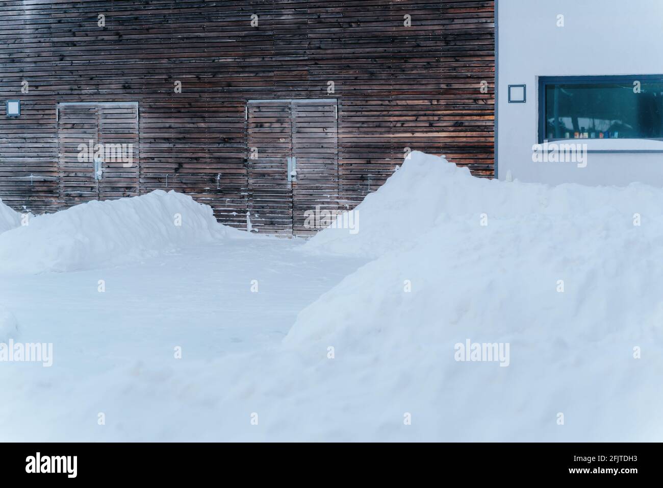 huge piles of snow covering doors and gates of houses Stock Photo - Alamy