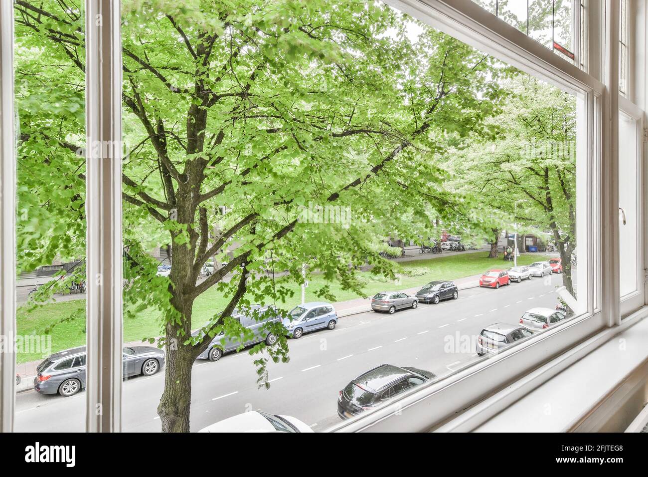 Summer town street behind window Stock Photo - Alamy