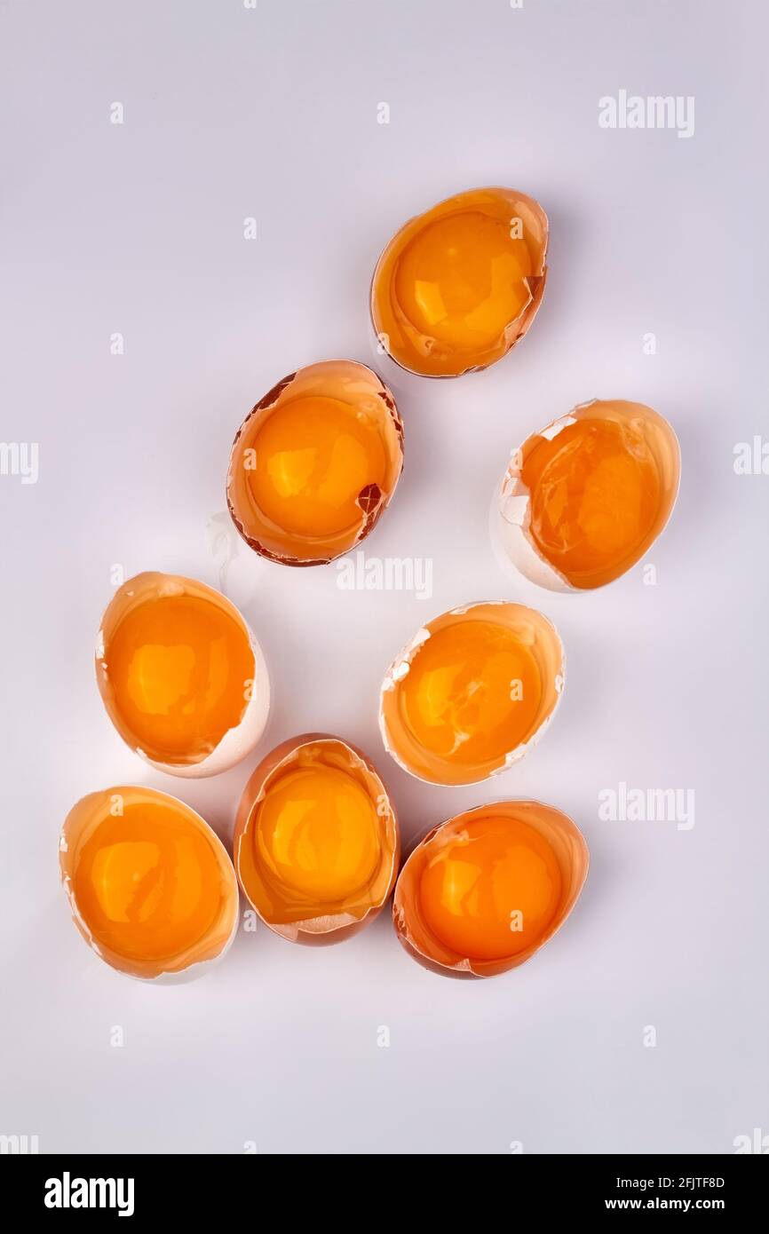 Chicken eggshell halves with yolk Stock Photo - Alamy