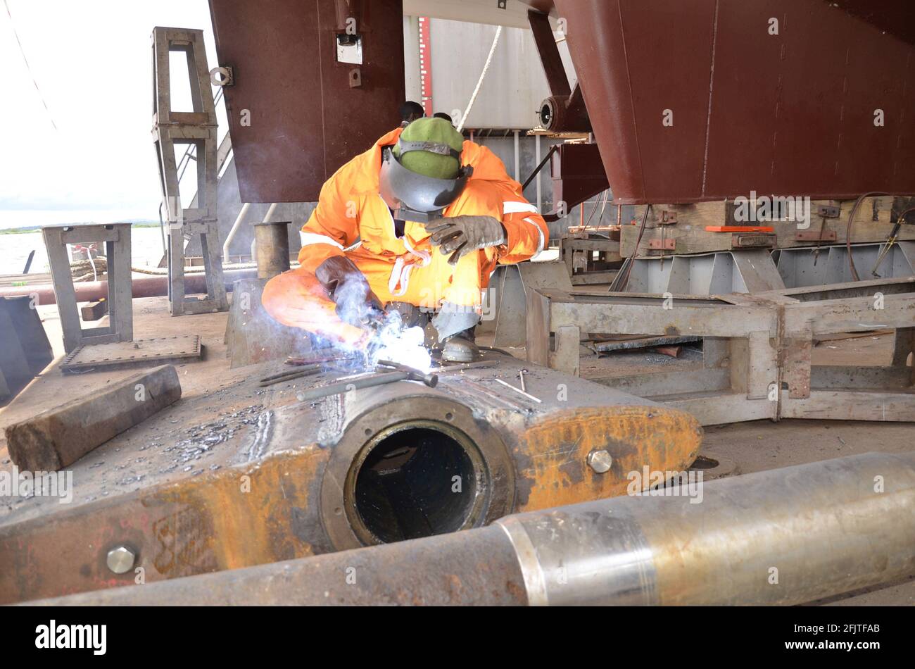 Kampala, Uganda. 21st Apr, 2021. A local worker operates on MV Pamba ...