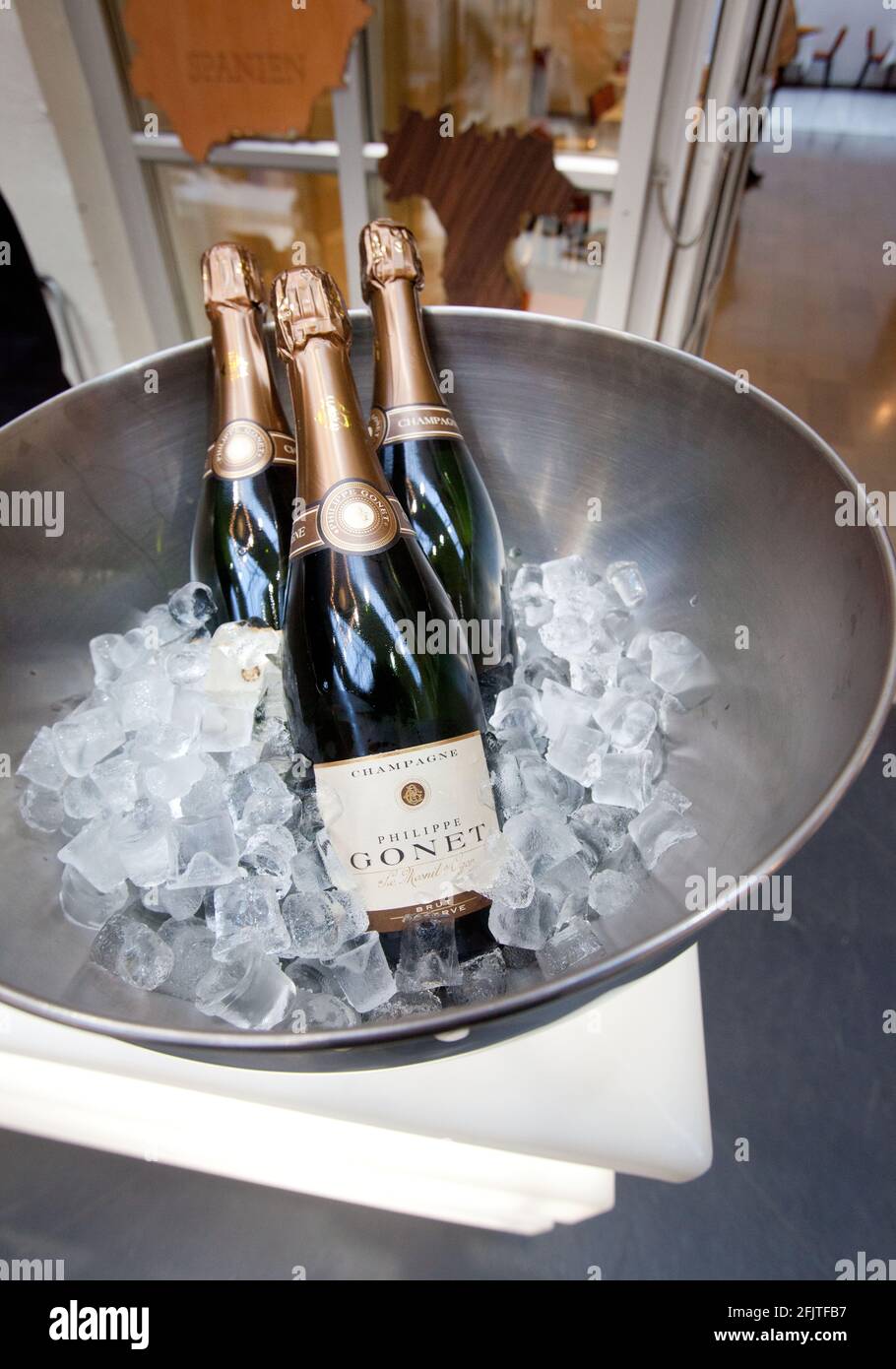 Champagne bottles in ice Stock Photo - Alamy