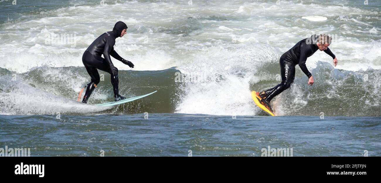 Inland surfers ride a wave at a river park on the Deschutes River in ...