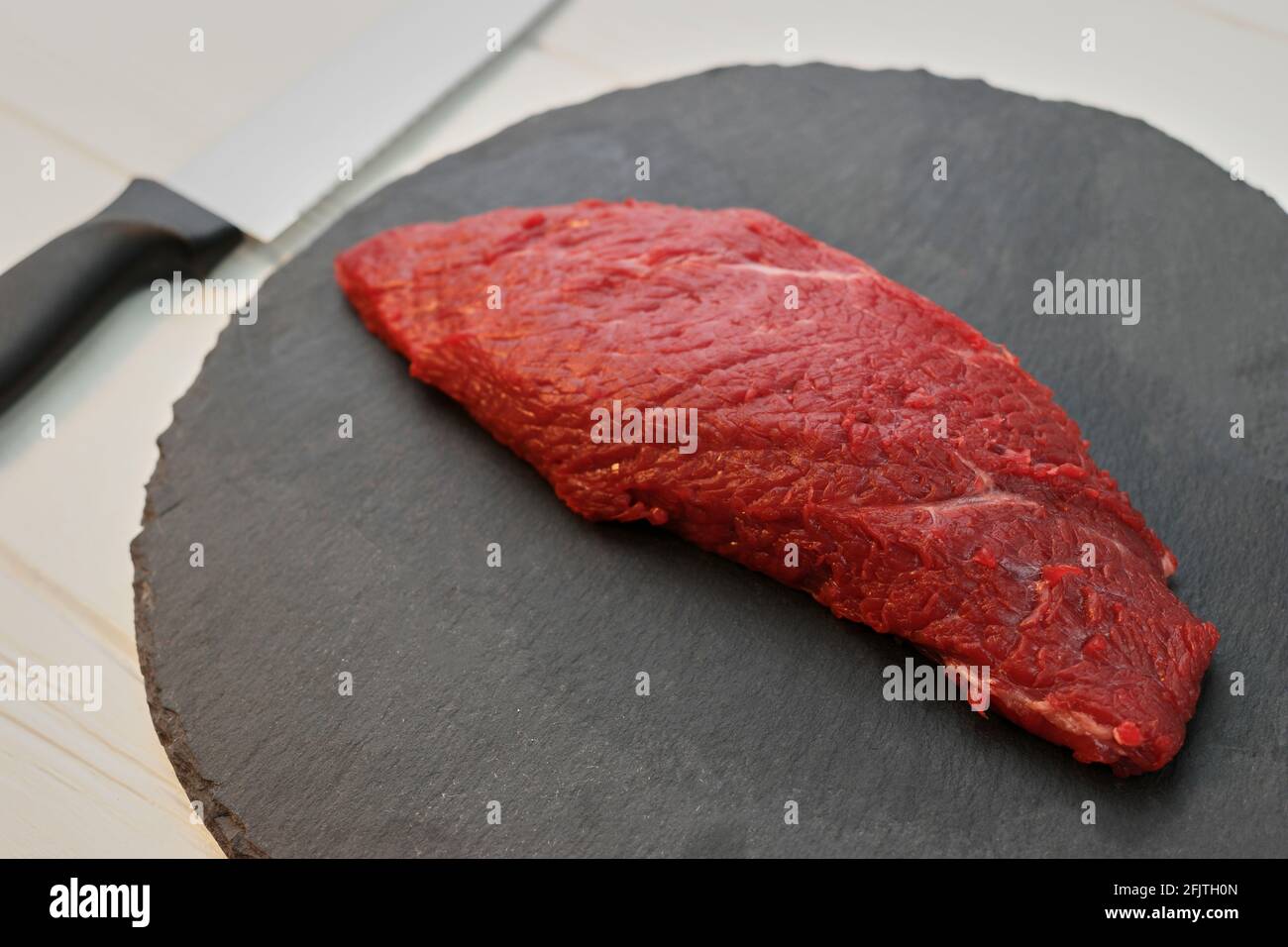 Close-up raw edible meat. Uncooked fresh beaf meat Stock Photo - Alamy