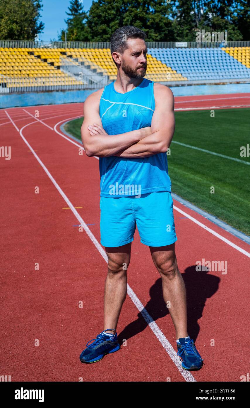muscular sportsman on stadium. athlete guy in sportswear. healthy ...