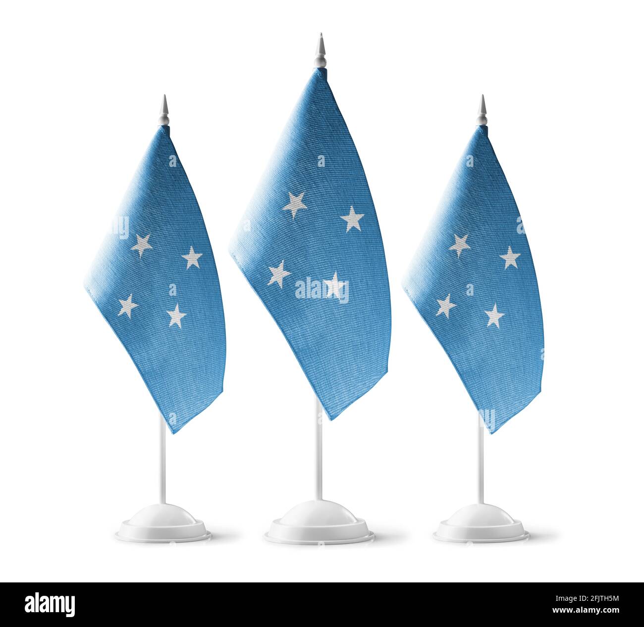 Small national flags of the Federated States Micronesia on a white ...