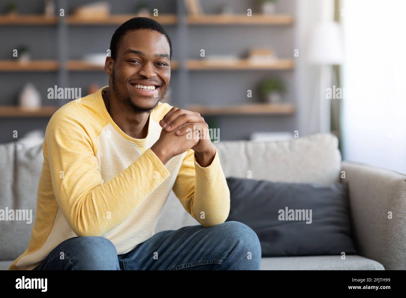 Chilling on sofa hi-res stock photography and images - Alamy