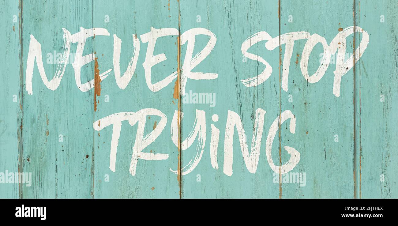 Motivational quote - Never stop trying Stock Photo - Alamy