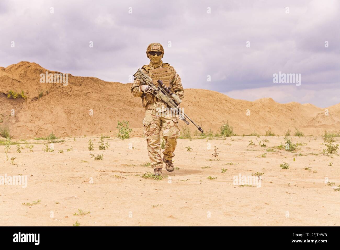 Fully equipped and armed special forces soldier in the desert, army ...