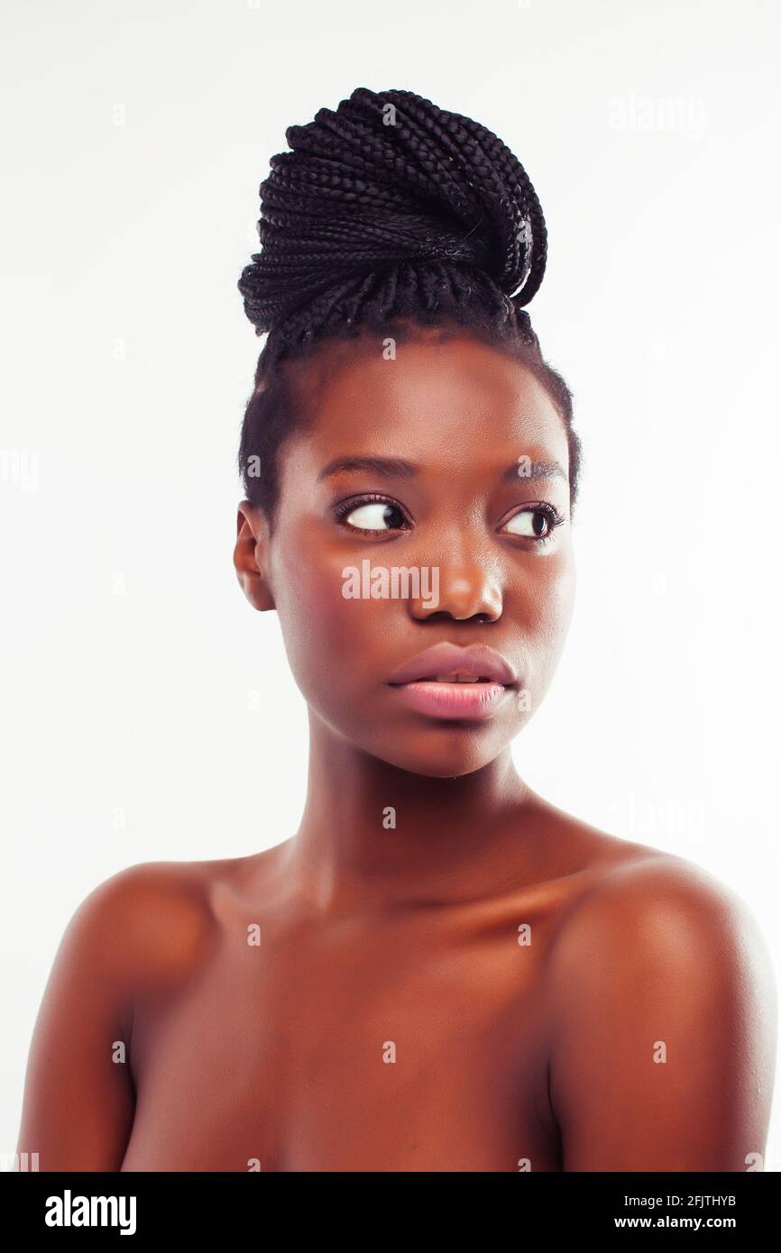 young pretty african american woman with natural makeup taking care of ...