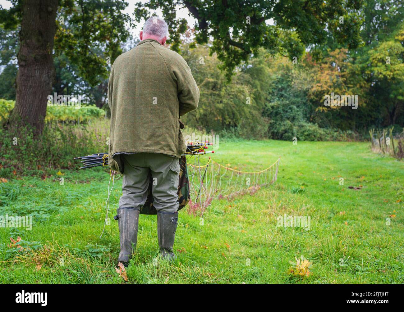 Kent, England, UK - A pest controller and warrener, working with a long ...