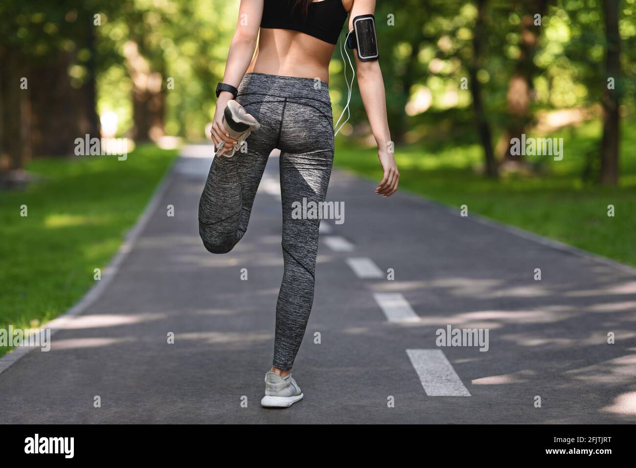 Fitness girl stretching legs hi-res stock photography and images - Alamy