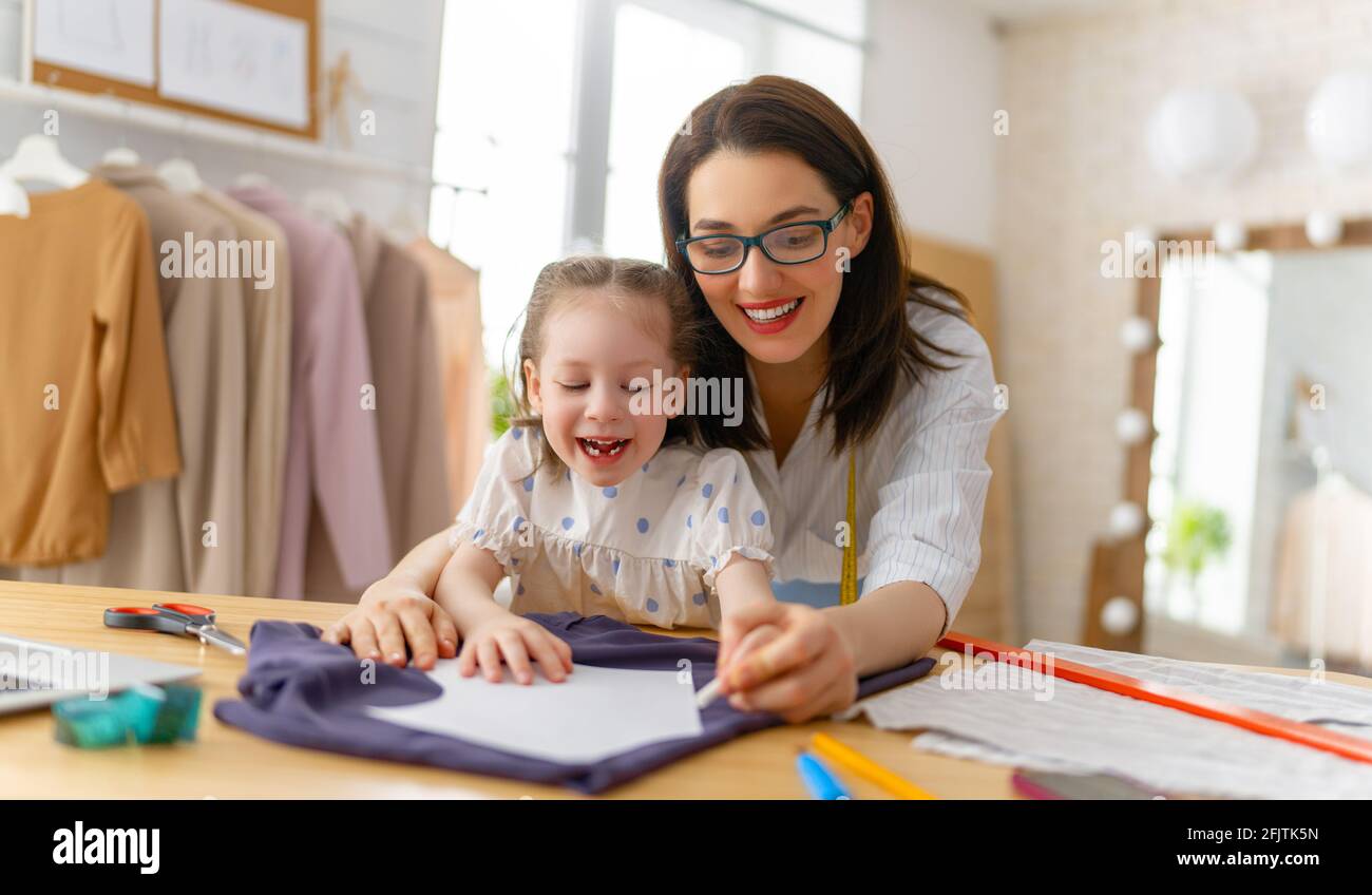 Woman is working at home workshop. Concept of small business. Mother ...