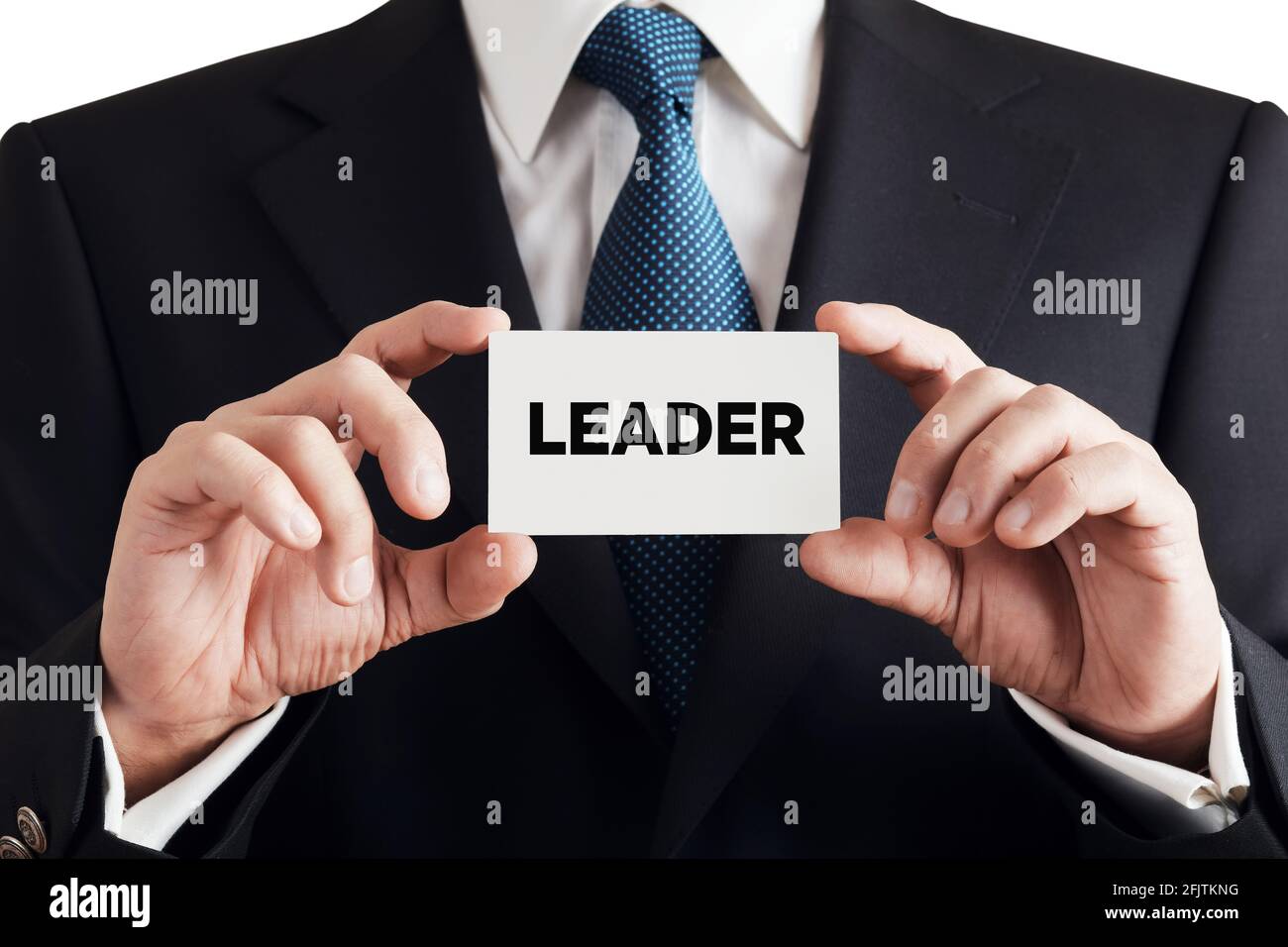 Businessman shows business card with the word leader. Business team or ...