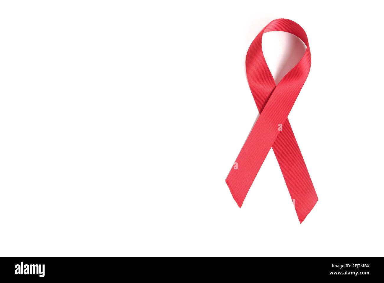 Red ribbon on white background is symbol of disease AIDS and drug abuse ...