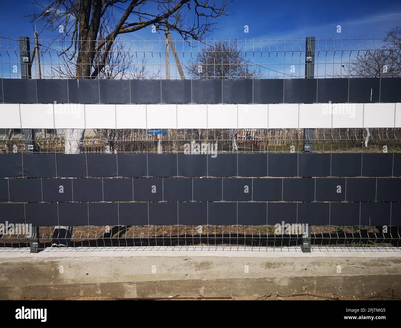 metal fence made of square pieces of metal Stock Photo - Alamy