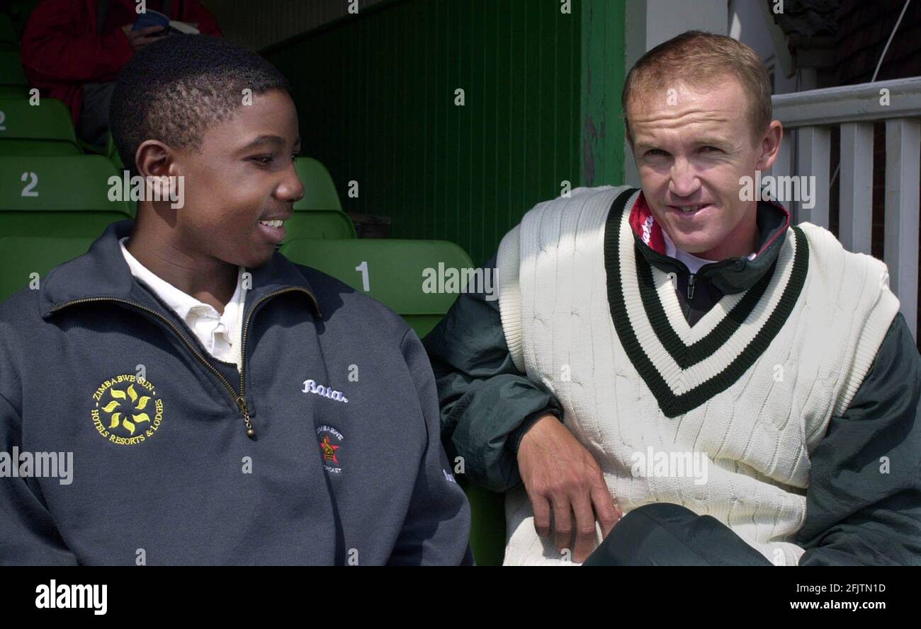 Andy Flower captain of the Zimbabwe cricket team with a young person ...