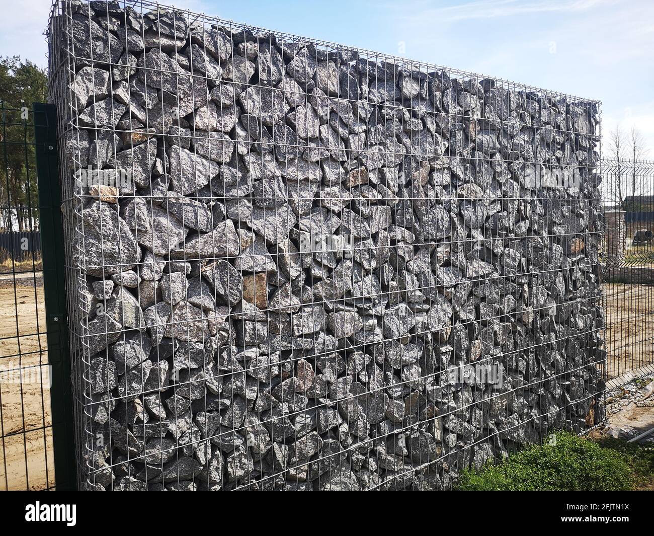 stone fence. rectangular stone fence Stock Photo - Alamy
