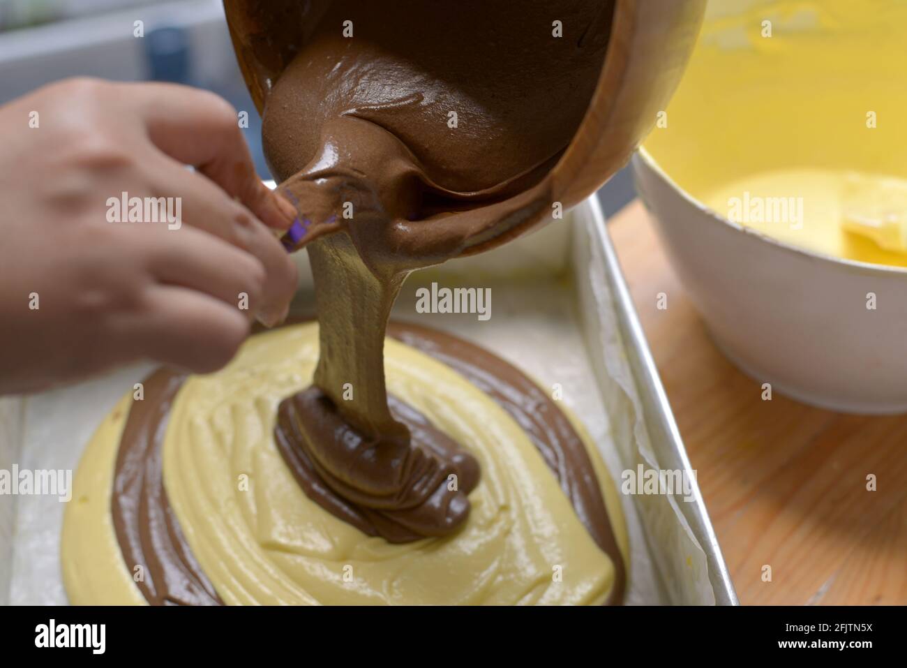 after mixing dough with mixer, put the dough to cake pan, ready for ...