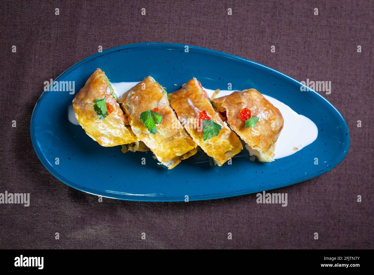 top view puff pastry roll with fish filling Stock Photo - Alamy