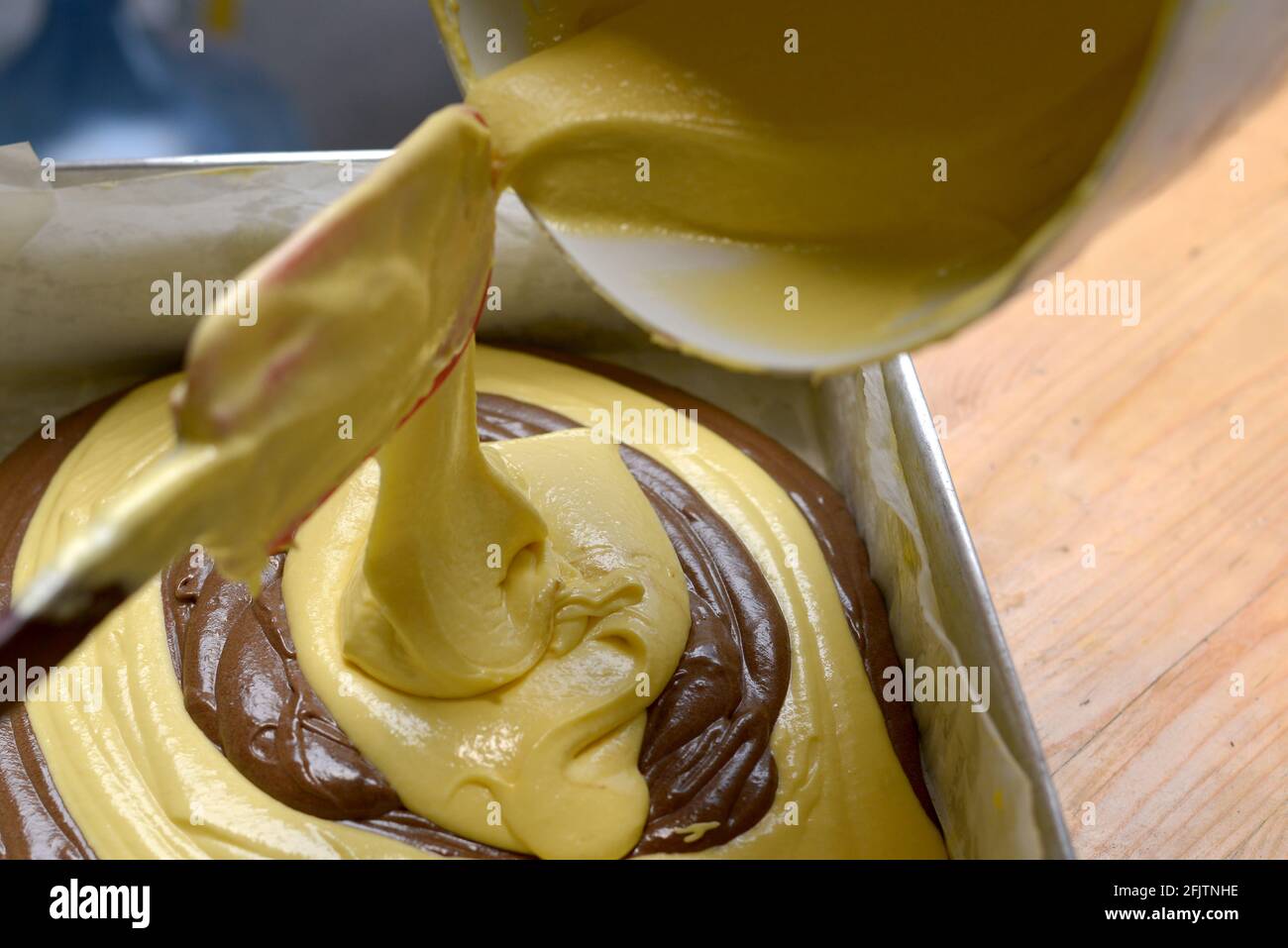 after mixing dough with mixer, put the dough to cake pan, ready for ...