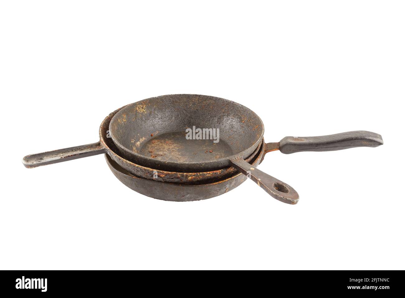 old disgusting stained rusty cast iron pan stack with burnt fat and ...