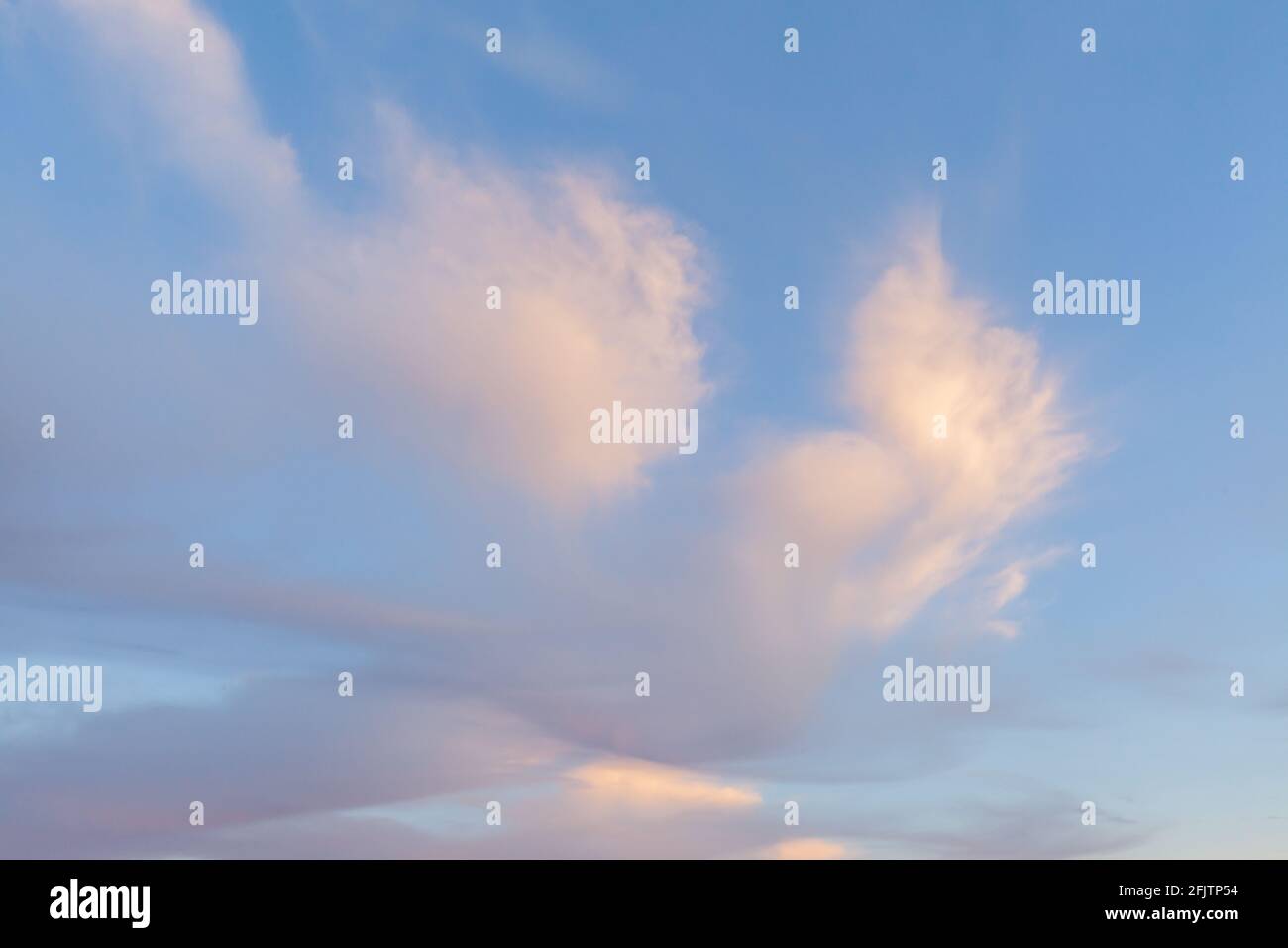 Pink sunset clouds and blue sky weather background Stock Photo - Alamy
