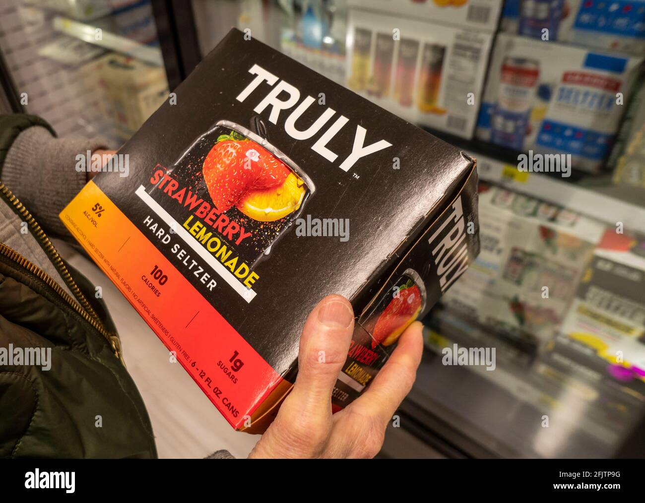 A customer chooses Boston Beer Co.Õs Truly Hard Seltzer in a ...