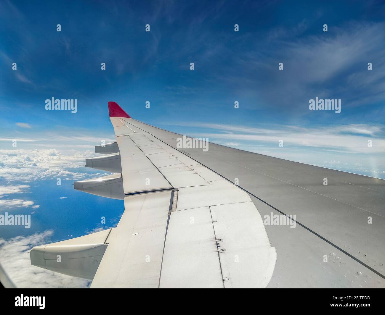 View through an airplane window at a high altitude flight Stock Photo ...