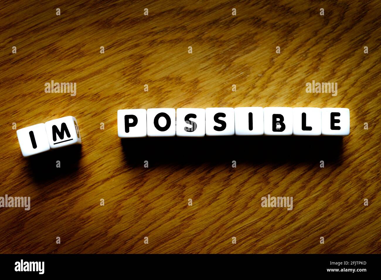 Impossible to possible words spelled out representing achievement and ...