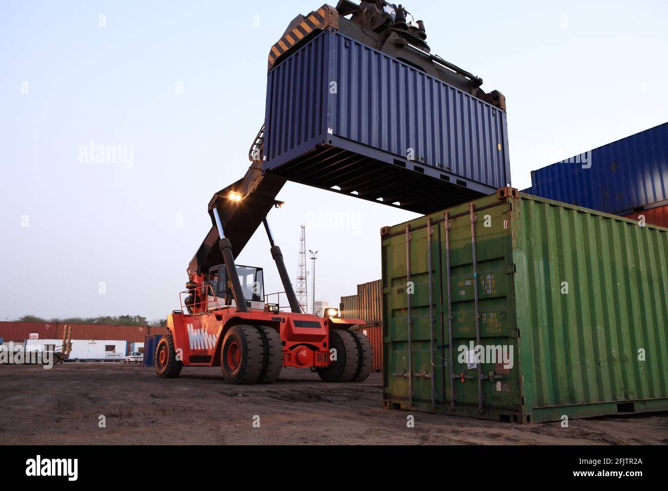 Forklift is lifting a cargo container hi-res stock photography and ...